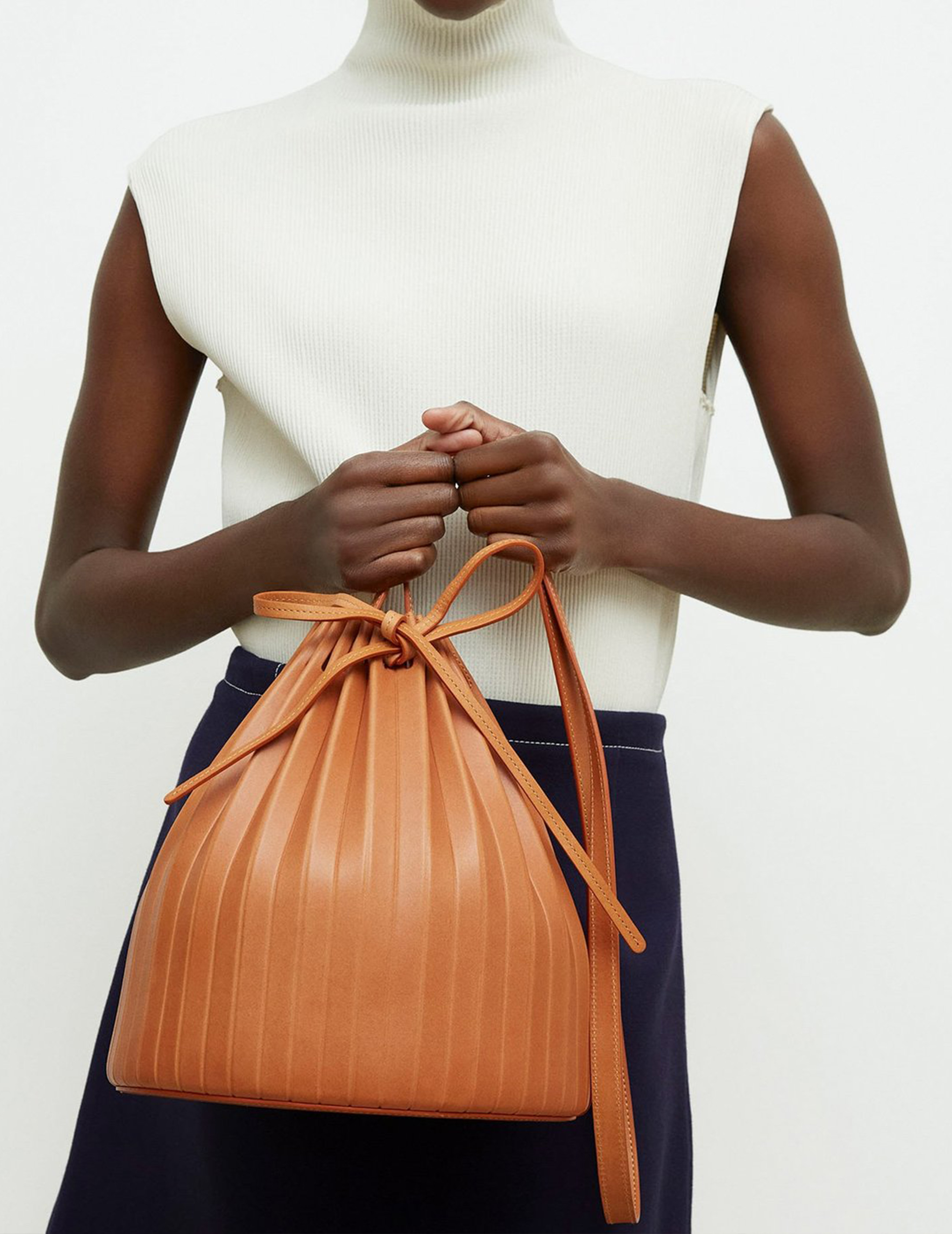 Fluting, grooves, ridges and creases make the creation twirl